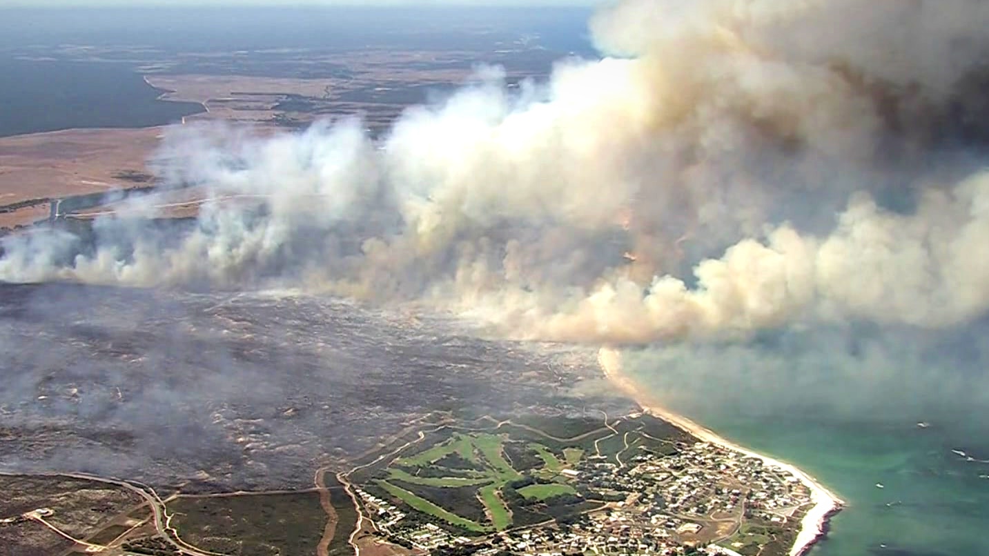 Ledge Point bushfire north of Perth downgraded to watch-and-act alert