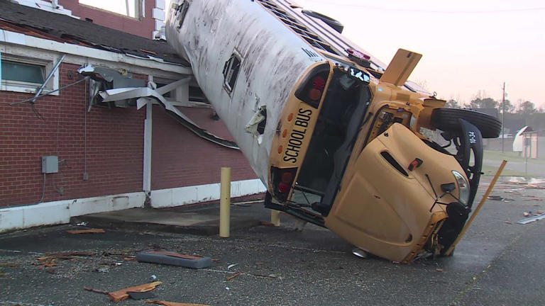 VIDEO: Bus on roof of Alabama high school after EF-2 tornado