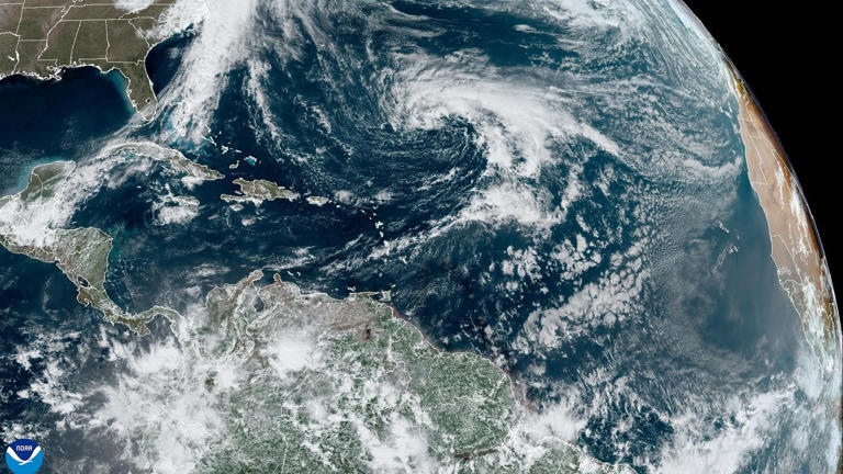 National Hurricane Center tracks disturbance in the Atlantic. Here's ...