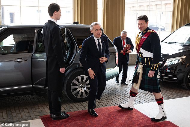 Mark Carney is greeted by equerry Johnny Thompson as he meets Charles