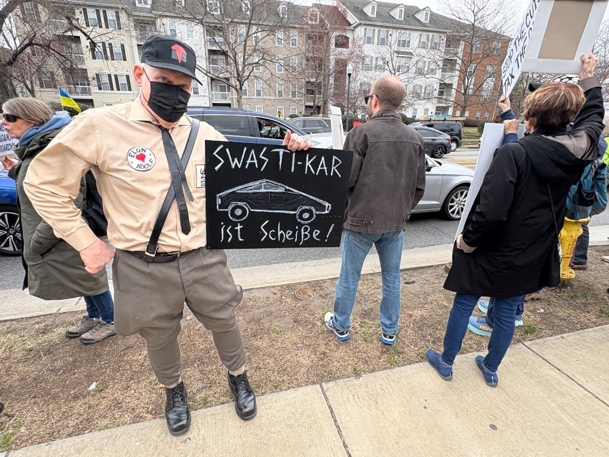 'In Your Face' Tesla Protest In Arlington Targets Trump, Musk Policies