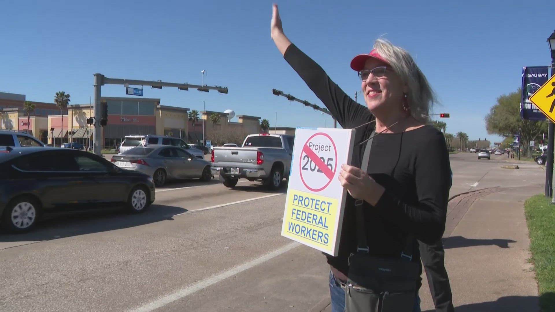 Federal workers in Houston rally against job cuts at USPS, NASA, NOAA
