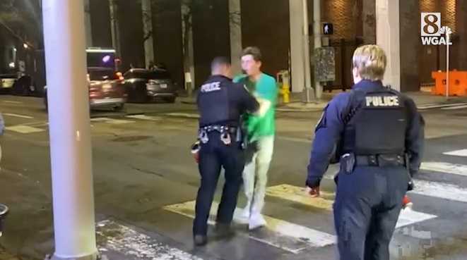 WATCH THE VIDEO | Officers take down suspect on street as cars pass by