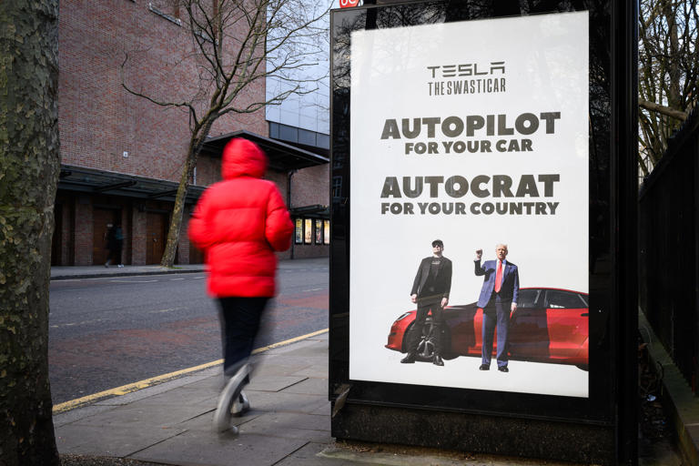 Activists used a Tesla to write 'Don't buy a Tesla' on a beach in Wales