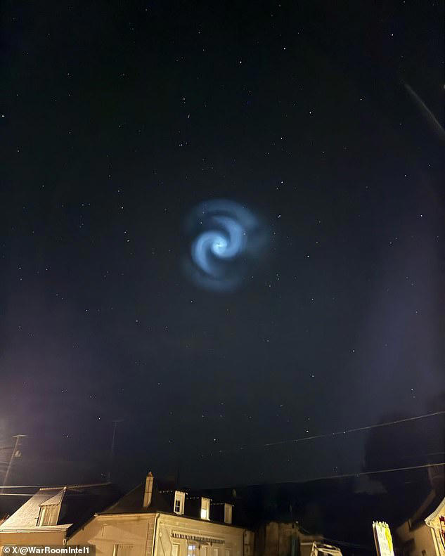 Mystery as huge spinning spiral spotted in the skies above Britain