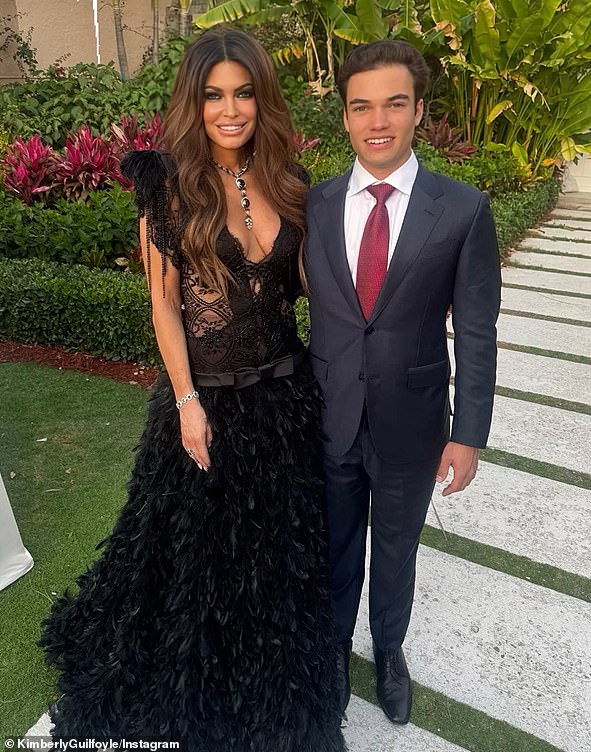 Kimberly Guilfoyle stuns in plunging black dress