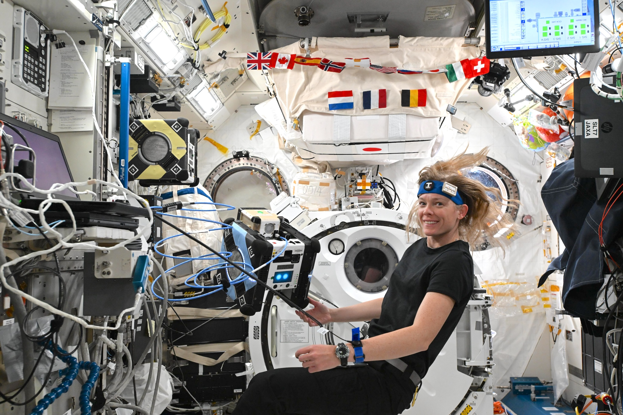 New ISS astronaut meets Bumble, Honey, and Queen robots