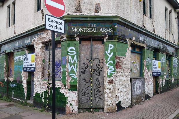 Pub owner denies breaching enforcement notice in dispute over green tiles
