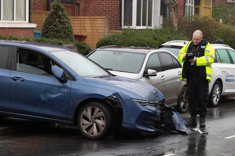 Cars wrecked and garden wall smashed in dramatic Manchester crash