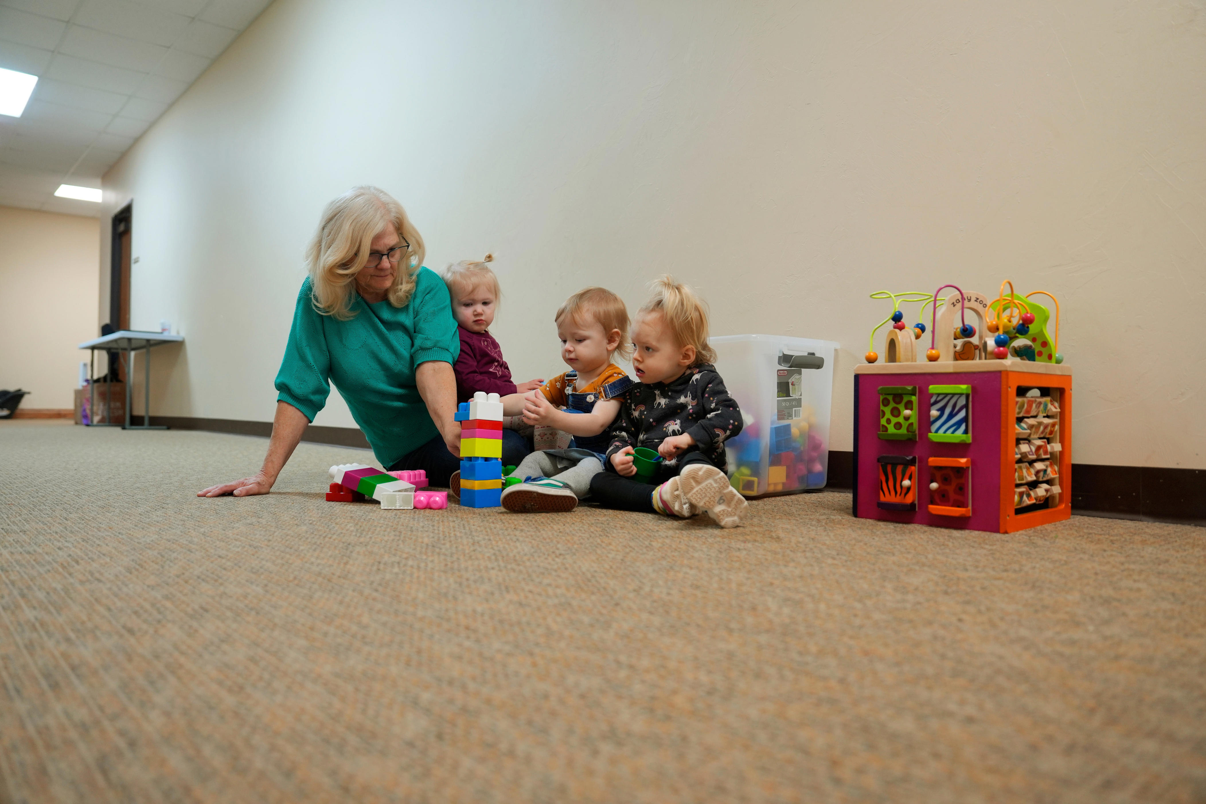 Senior adult volunteers are helping an intergenerational preschool ...