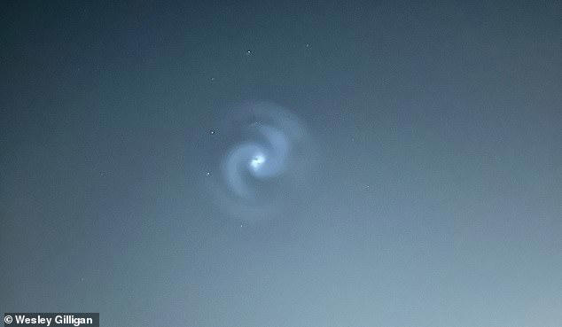 Mystery as huge spinning spiral spotted in the skies above Britain