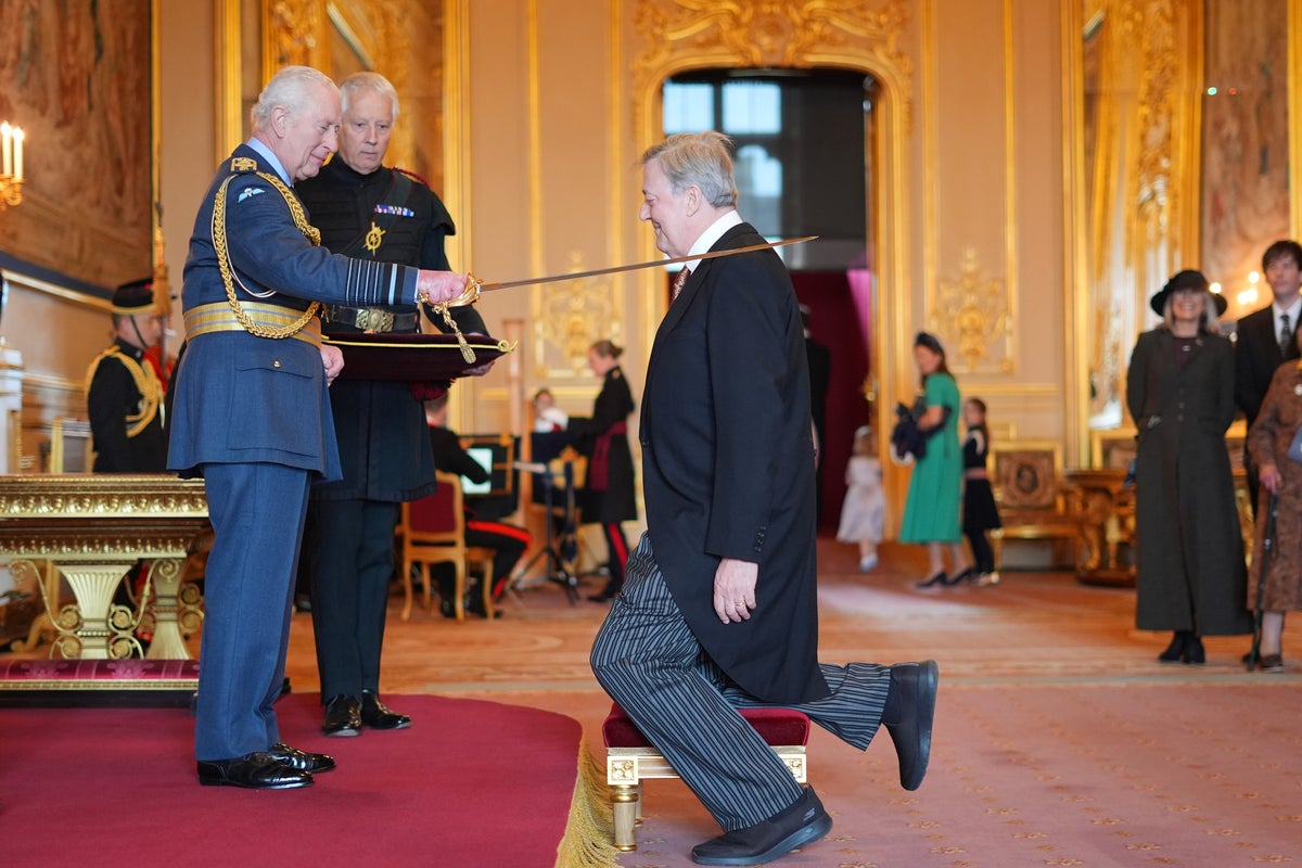 ‘Very honoured’: Sir Stephen Fry knighted by the King