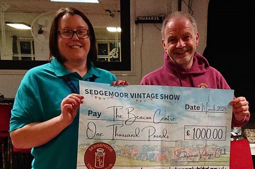 Vintage cars drive charity forward with cheque for local cancer care