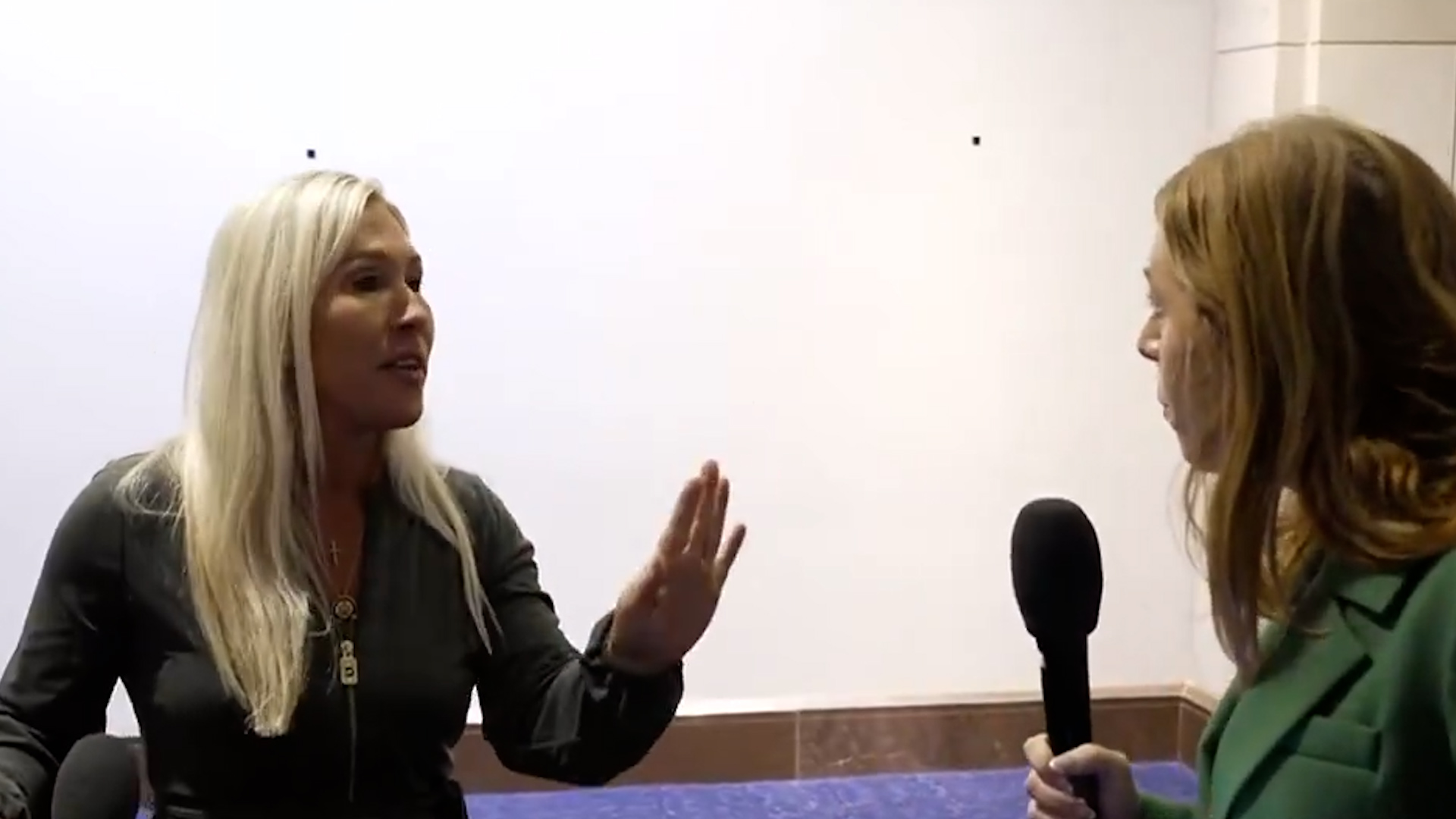 Marjorie Taylor Greene Clashes with UK Reporter Over Signal App Controversy