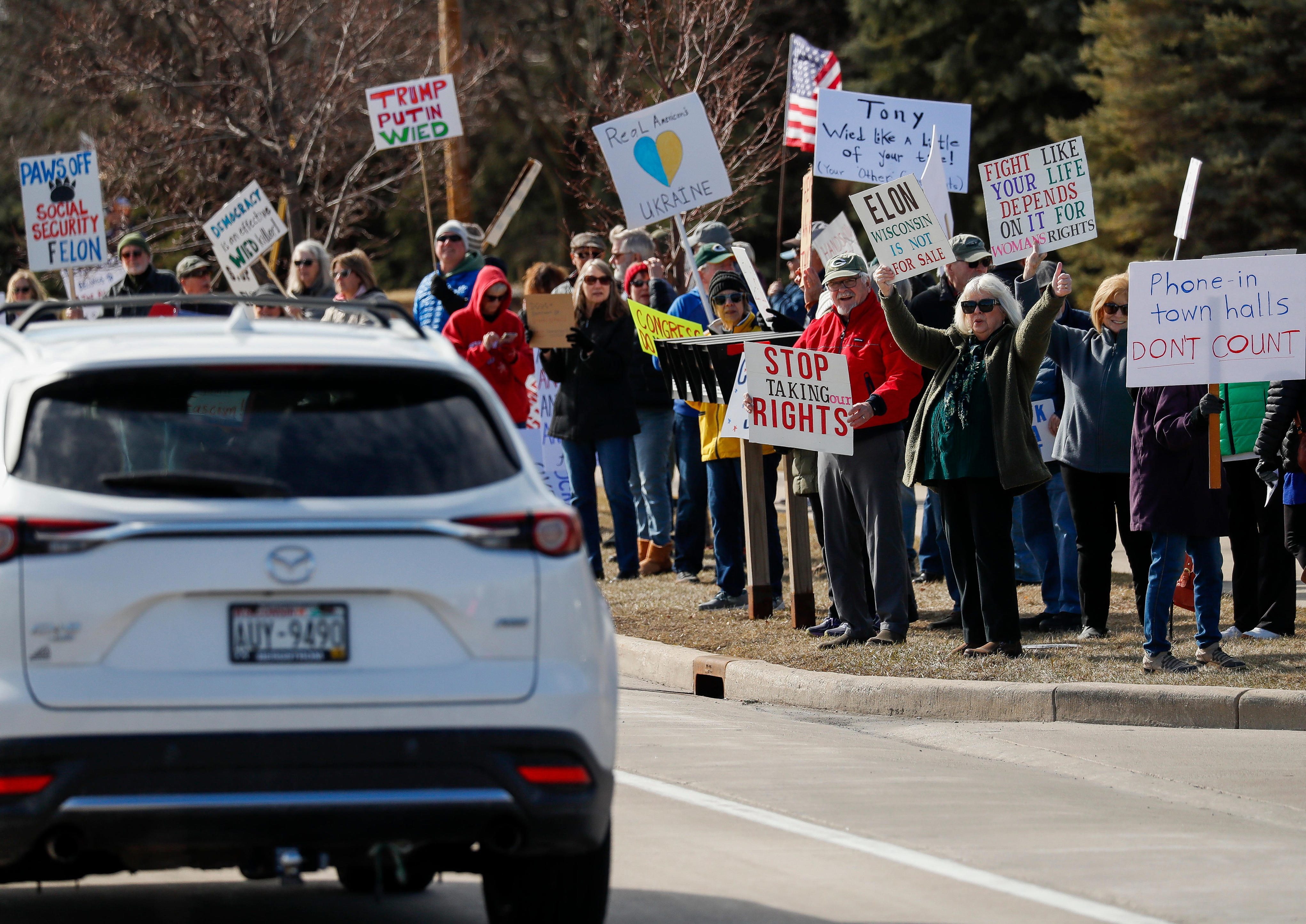 Demonstrators at Tony Wied's office protest congressman's lack of face ...