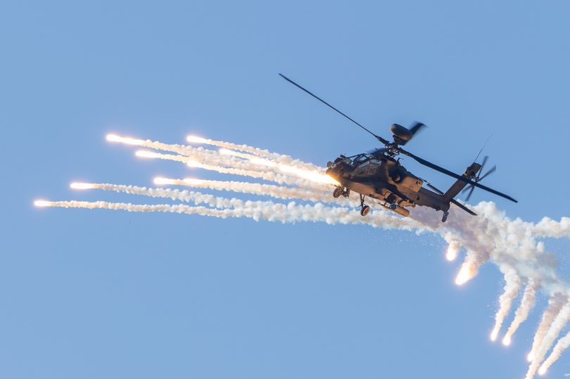 Dramatic moment Apache gunships carry out evasion drills over countryside