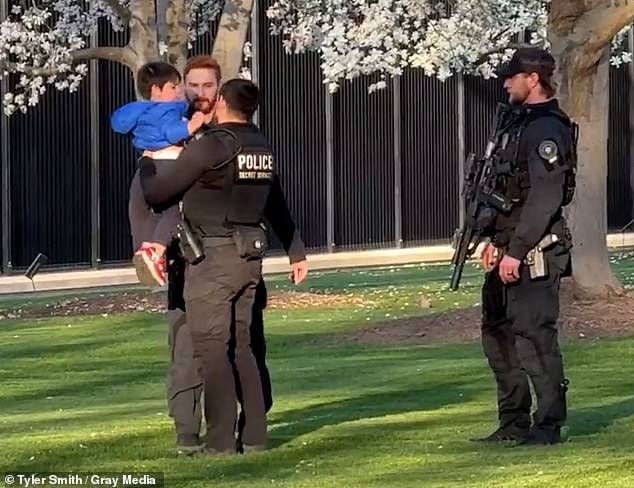 Internet swoons over White House guard who carried boy back to parents