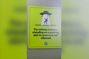 Alien abduction? Amusing signage discourages parking slot reservation