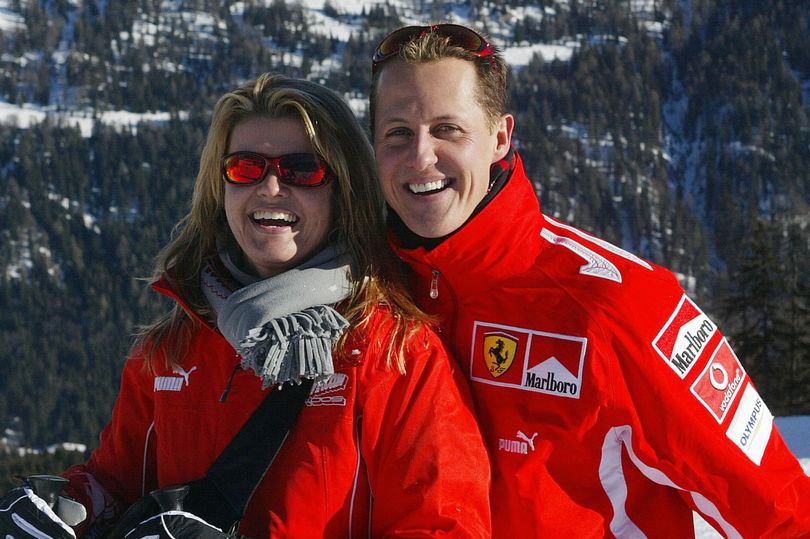 Michael Schumacher signs F1 helmet with help of his wife, Corinna, in ...