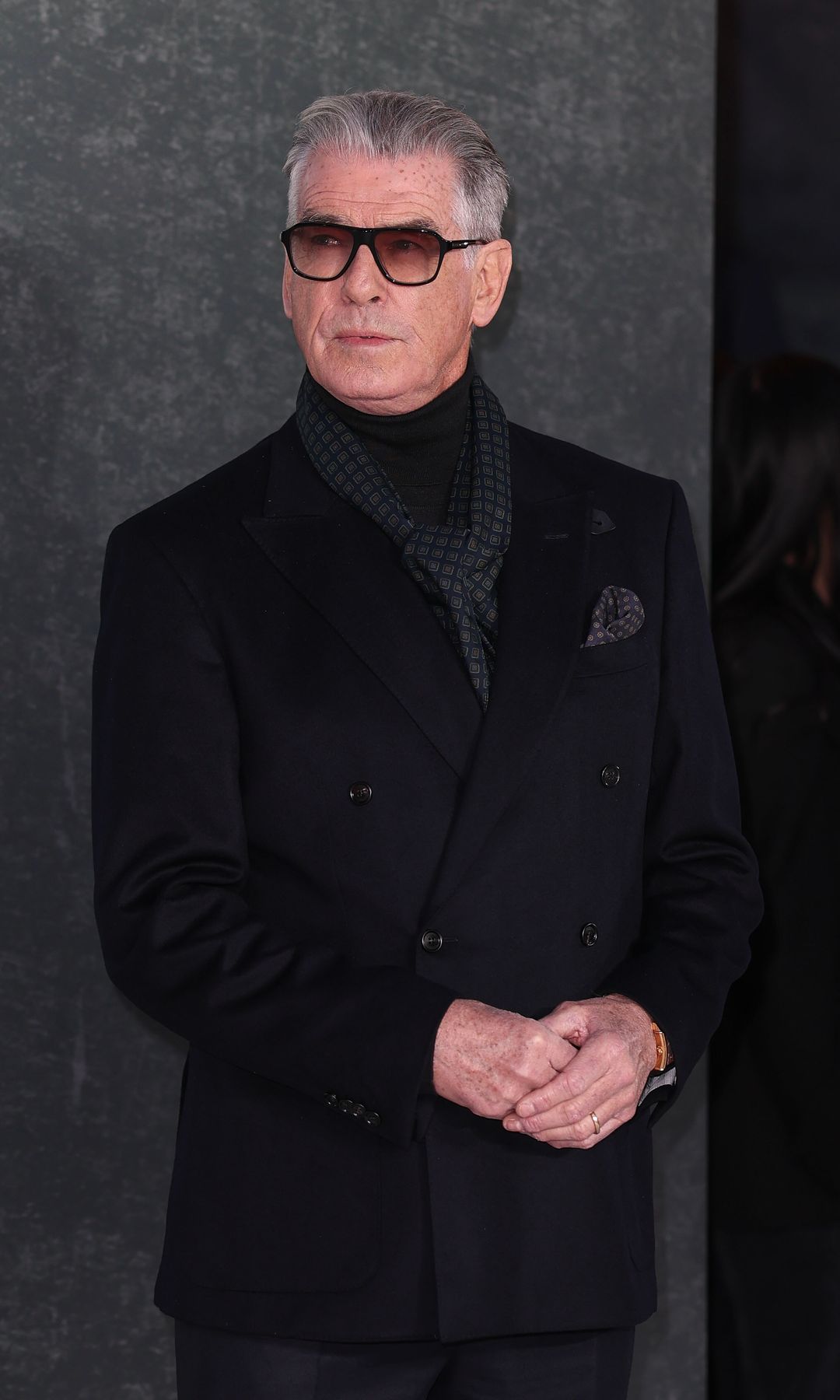 Pierce Brosnan and Tom Hardy cut stylish figures as they lead stars at ...