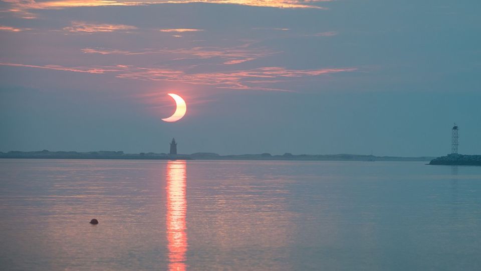 How to see a partial solar eclipse turn the sun into a crescent