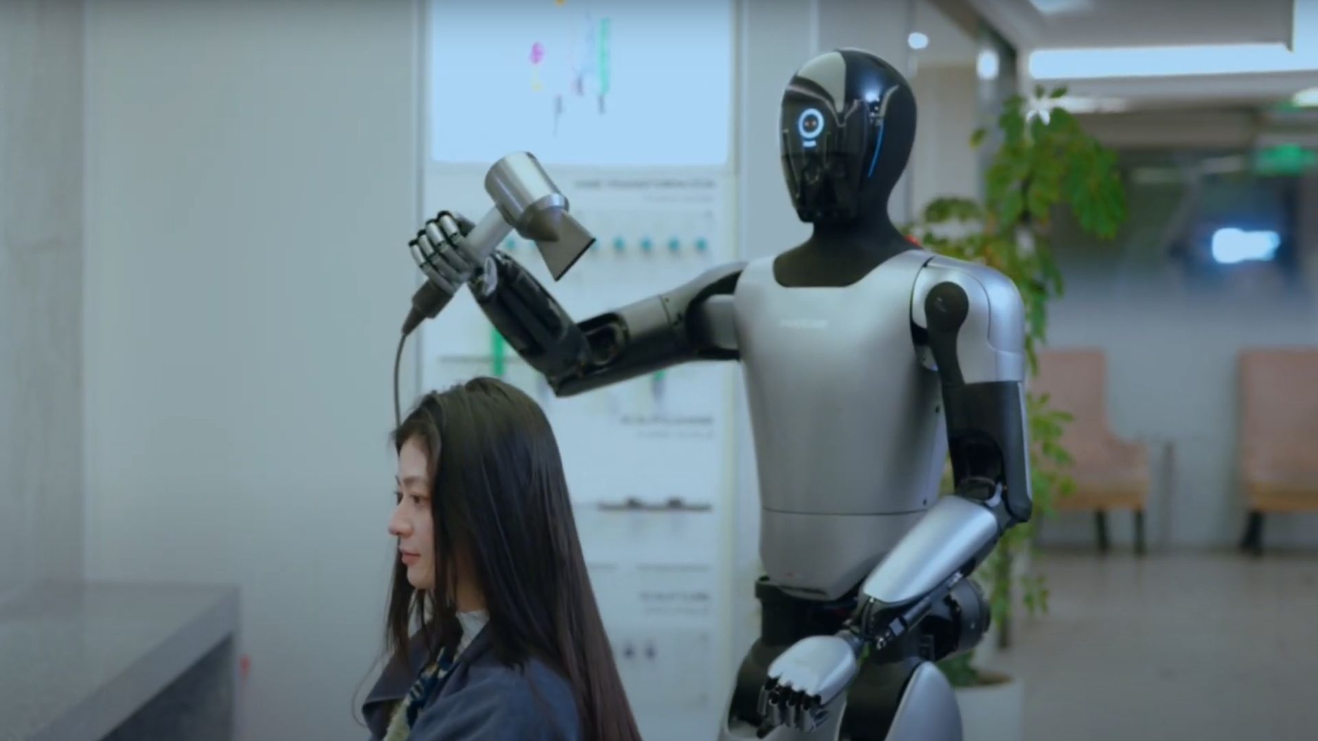 Video: China’s humanoid robot helps with hair styling, hotel services ...