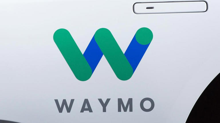 Waymo vehicles stop traffic on Austin bridge during severe storm Sunday ...