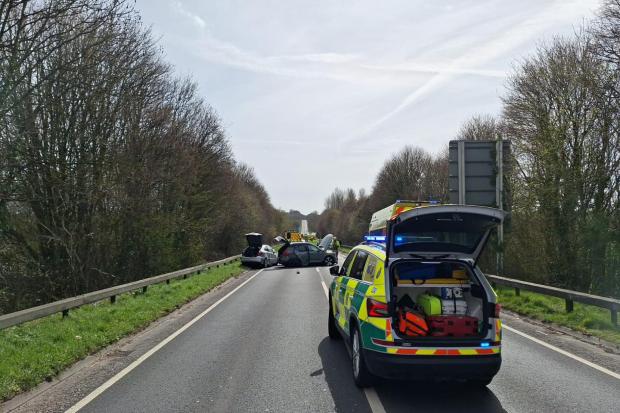 Three people rushed to hospital after A35 crash