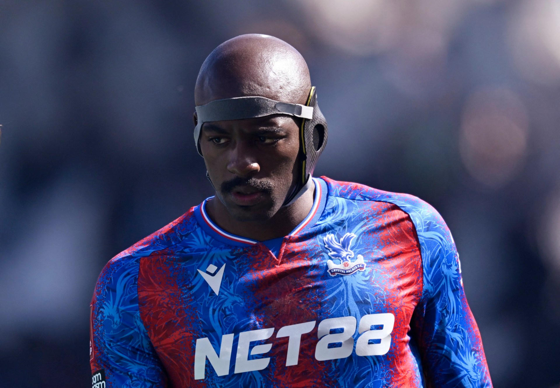 Jean-Philippe Mateta wears protective helmet after ear injury in ...