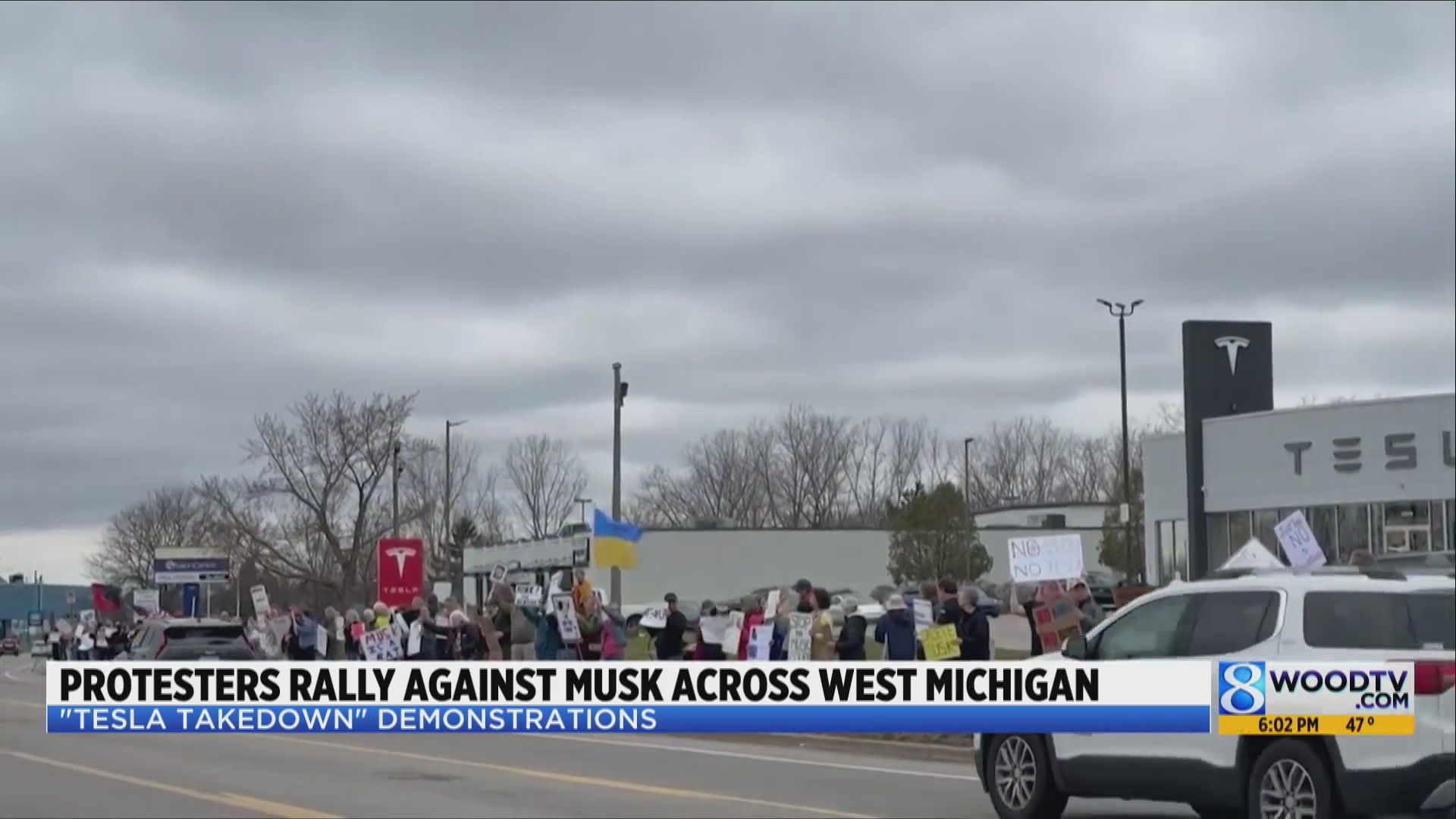 Michigan protesters rally against Elon Musk in 'Tesla Takedown ...
