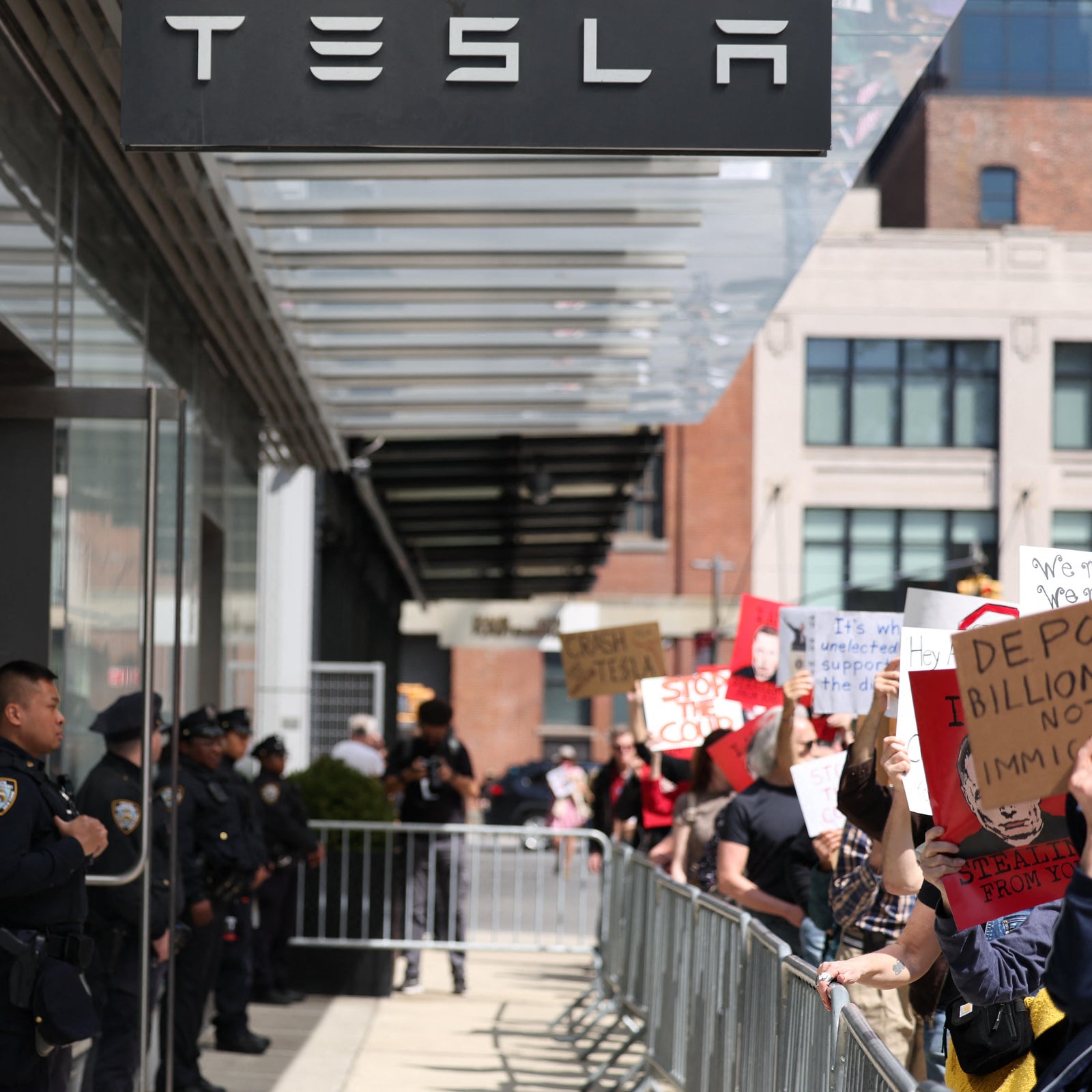 Protesters rally at Tesla showrooms in U.S., Europe to protest Elon Musk