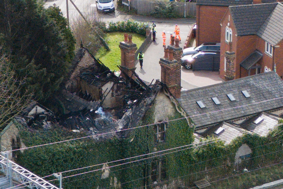 Three dead and police injured after fire rips through Kettering home