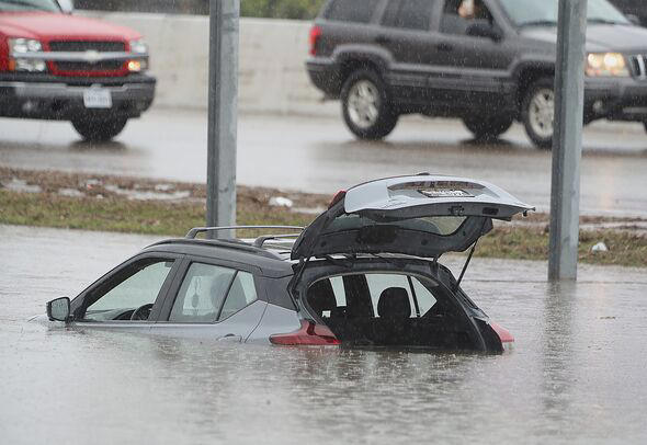 Texas flooding: Terrifying images show cars underwater as four dead in ...