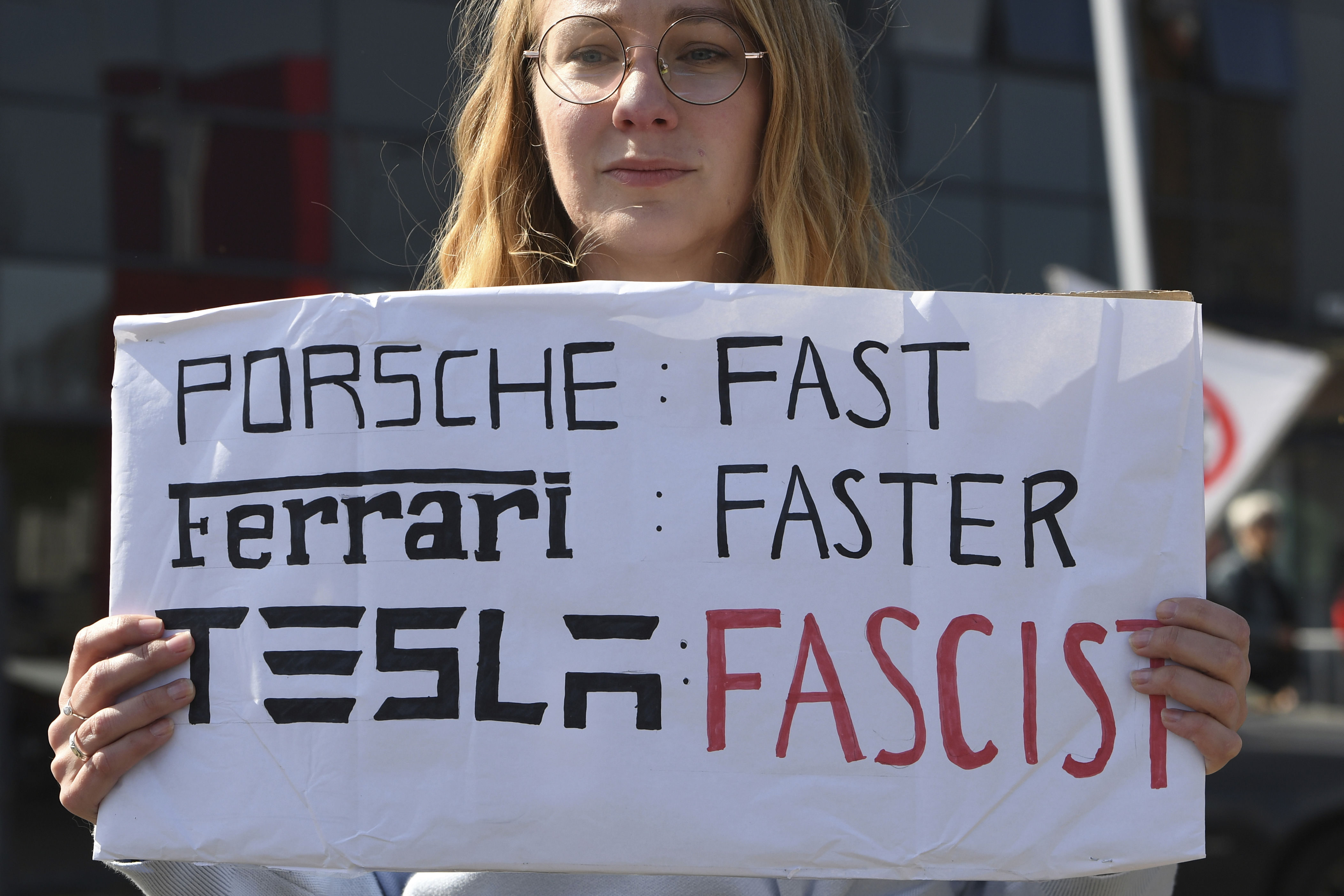 Tesla Takedown protests LIVE: Demonstrators rally outside London Tesla ...