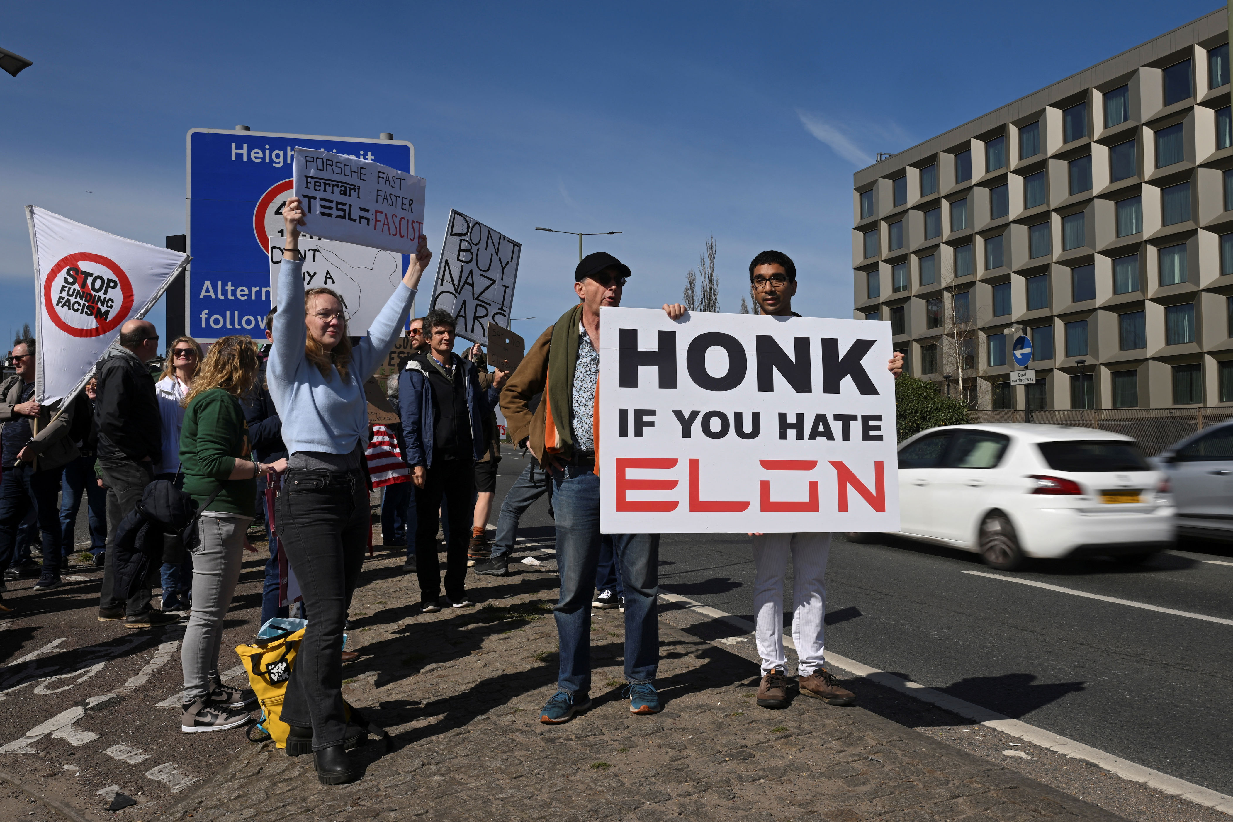 Tesla Takedown protests LIVE: Demonstrators rally outside London Tesla ...