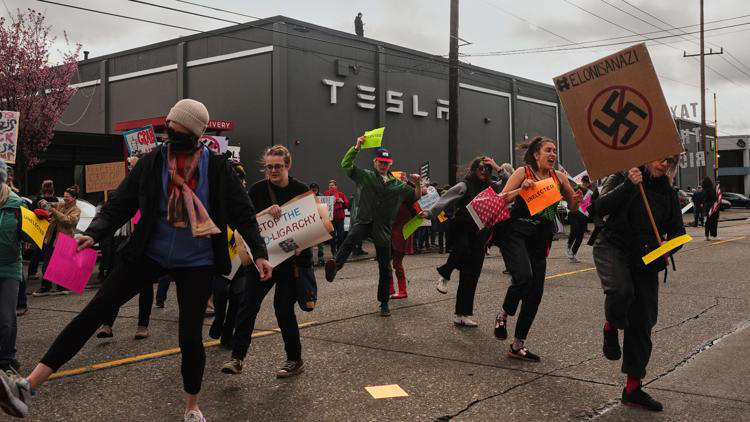 Hundreds protest outside Seattle-area Tesla dealerships as part of ...