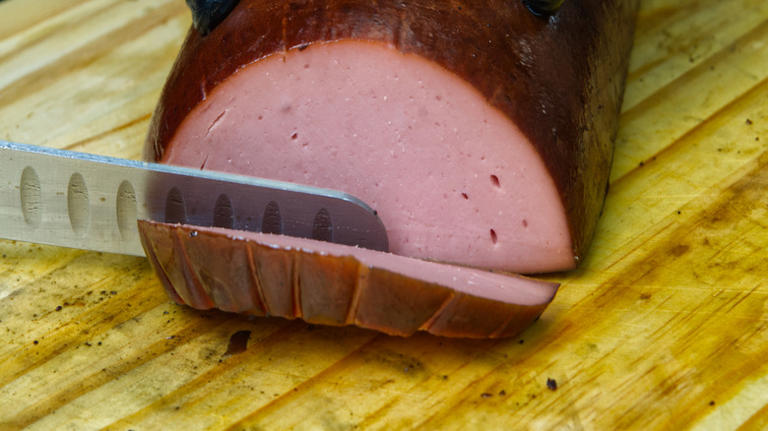 Emeril Lagasse's Favorite Way To Make Bologna Comes With A Sweet Twist