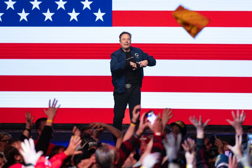 Elon Musk runs out on stage in cheese hat as he hands out $1 million ...