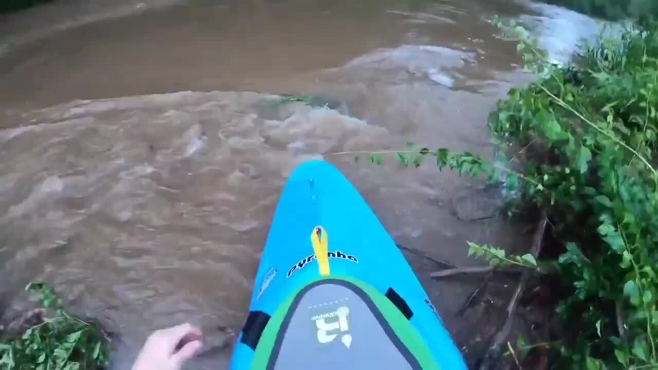 Kayakers Have Fun Going Down Flooded Creek