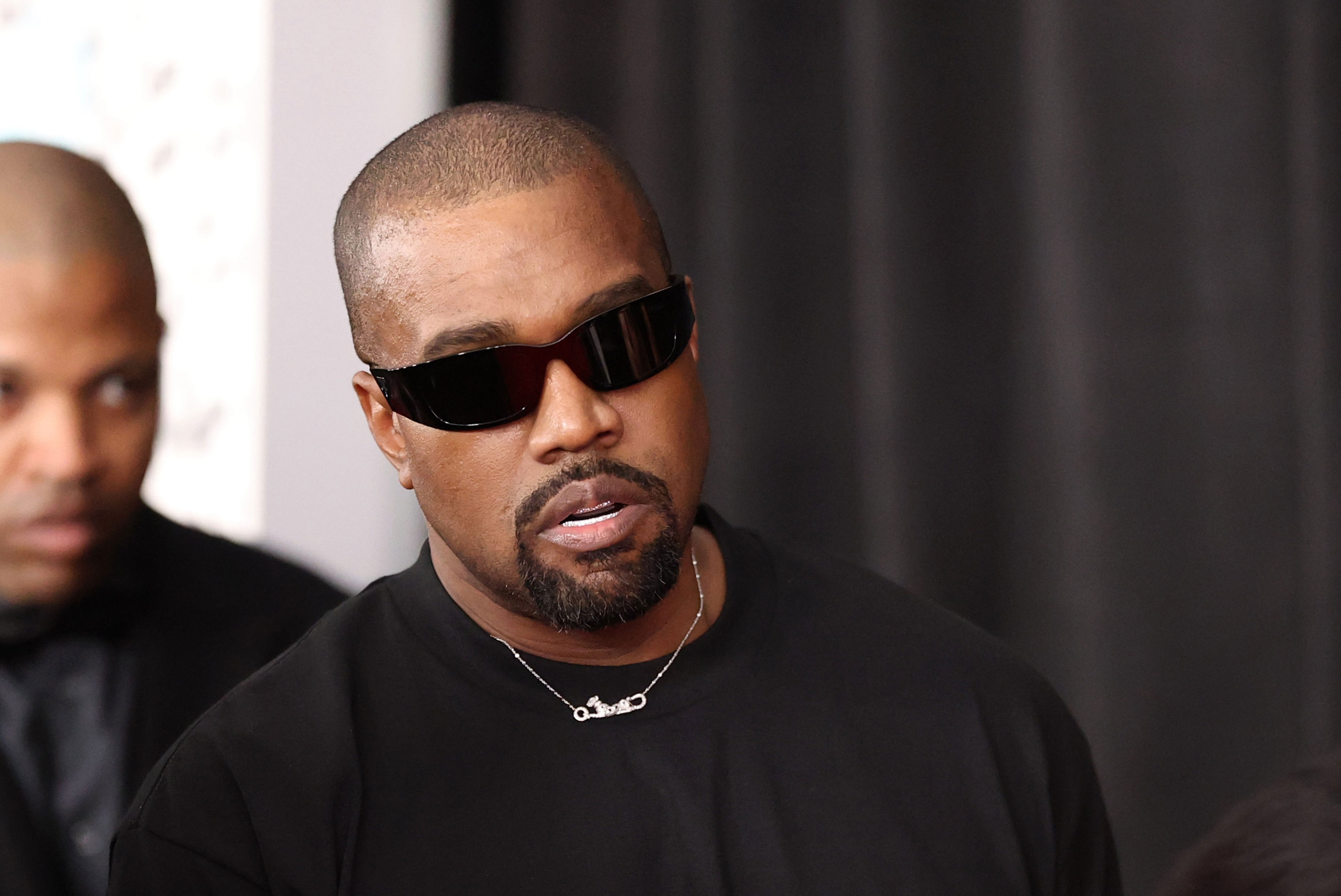 Kanye West condemned for wearing black KKK outfit during controversial ...
