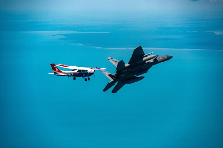 Dramatic Moment U.S. F-15 Fighter Jet Intercepts Small Plane in Mid-Air