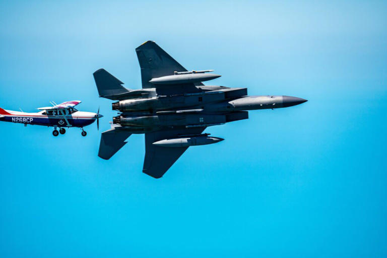 Dramatic Moment U.S. F-15 Fighter Jet Intercepts Small Plane in Mid-Air