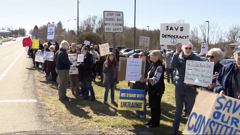Protestors voice concerns over federal budget cuts outside local ...