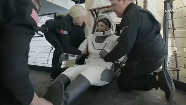 Stranded astronauts leave space capsule after 17-hour journey from ISS