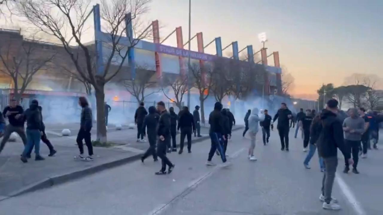 Rival football fans fight outside stadium in France
