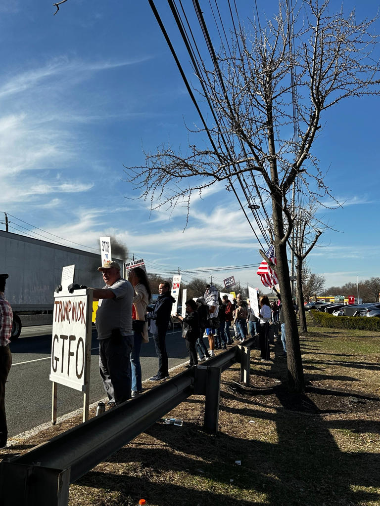 Over 100 protest Elon Musk outside Route 17 Tesla dealership in Paramus