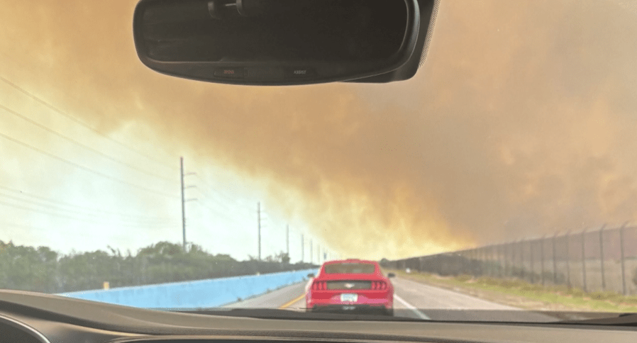 ‘Floor it, you gotta get past’: Family barely escapes brush fire after ...