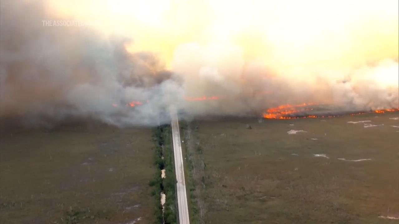 Large brush fire, smoky conditions shut down road leading in and out of ...