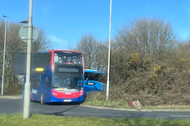 Coach breaks down at busy roundabout