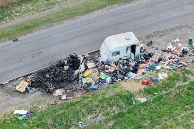 Caravan is destroyed by fire after council orders owner to move on